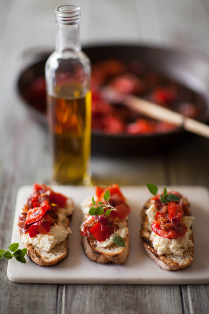 Peperonata, goat's cheese and ricotta on sourdough — Belinda Jeffery